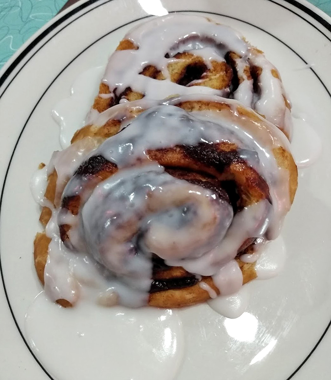 Cinnamon rolls drowning in glaze that would make even your most disciplined friend say, "Well, maybe just this once." Worth every sticky finger.