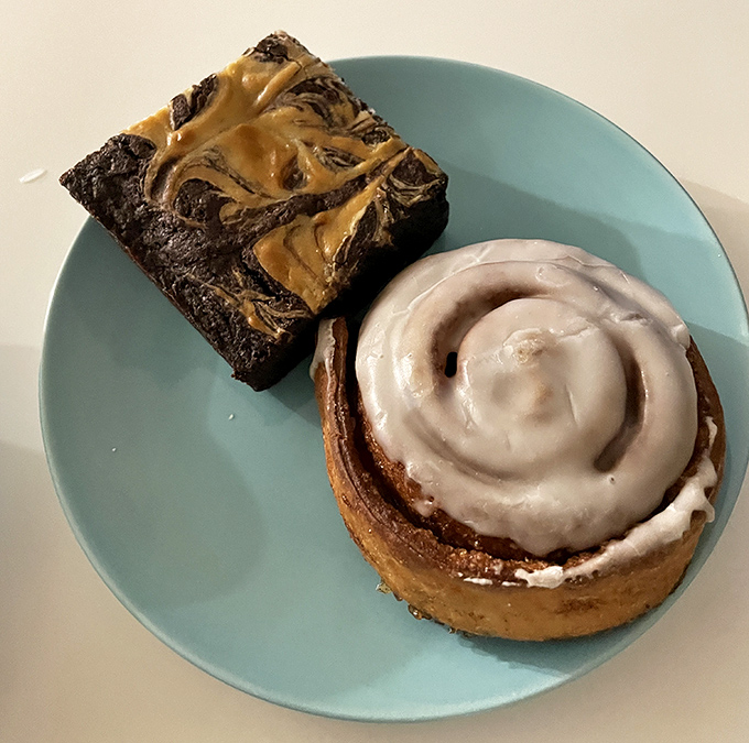 The dynamic duo: a pillowy cinnamon roll with perfect swirls alongside a fudgy brownie marbled with peanut butter. Breakfast of champions!