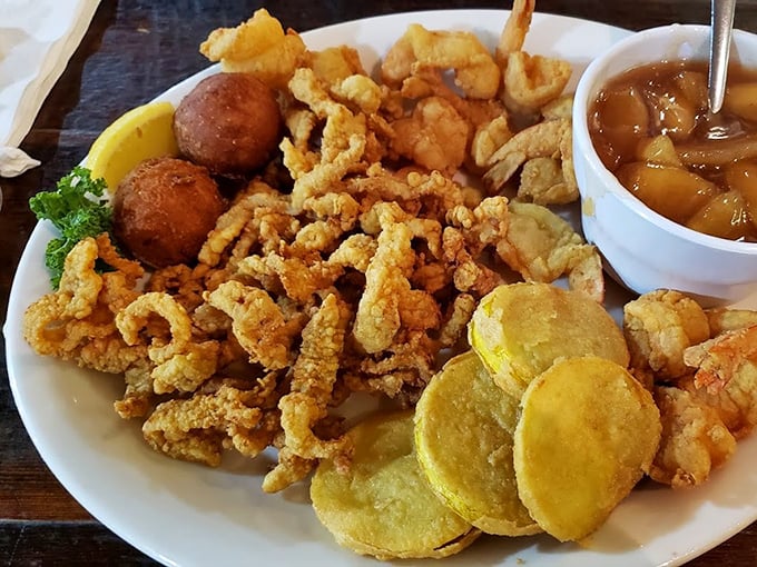A symphony of textures on one plate&mdash;crispy seafood, golden fried squash, and those addictive hush puppies that keep stealing the spotlight.
