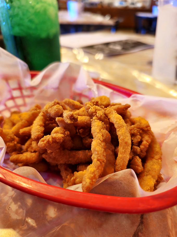 Golden-fried clam strips that crunch like your favorite childhood memory. The basket they're served in is just a formality&mdash;they won't last long.