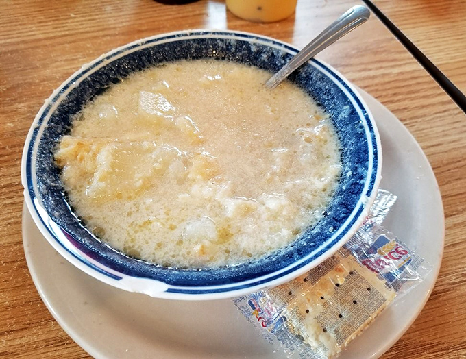 Clam chowder so hearty it could qualify as a main course. The blue-rimmed bowl is practically a warning: "Prepare for flavor overload."