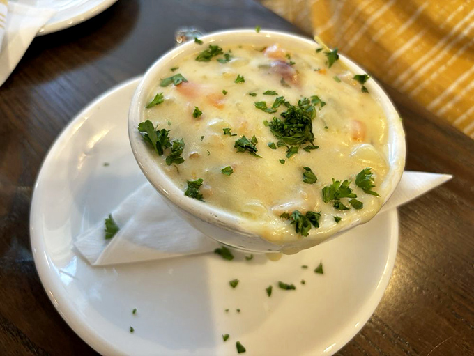 A bowl of clam chowder that strikes the perfect balance between creamy indulgence and briny ocean flavor. Each spoonful is a warm hug from the sea.