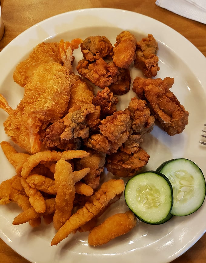 A seafood sampler that would make Neptune himself nod in approval &ndash; crispy, golden morsels arranged like edible jewelry.