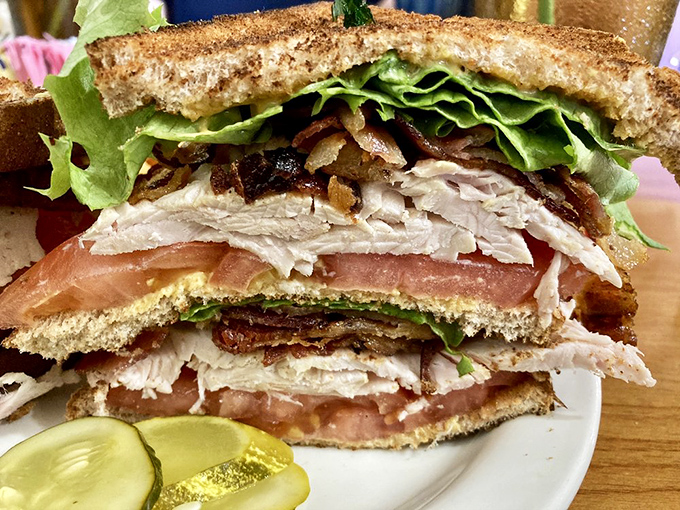 The club sandwich that launched a thousand lunch breaks - layers of turkey, bacon, and fresh veggies between perfectly toasted bread.
