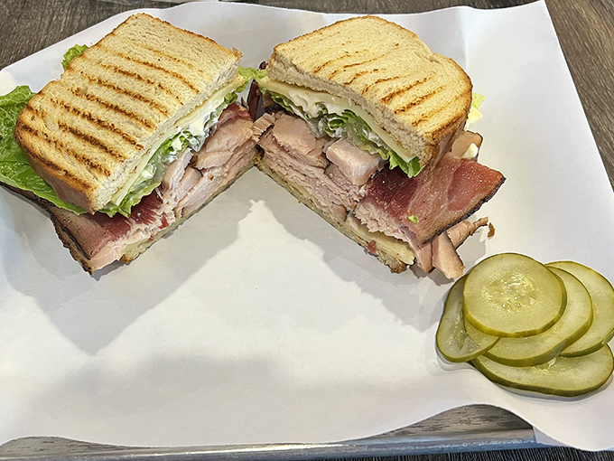 Even the sandwich game is strong here &ndash; layers of smoky meat between grilled bread with those bright pickle coins standing guard. 