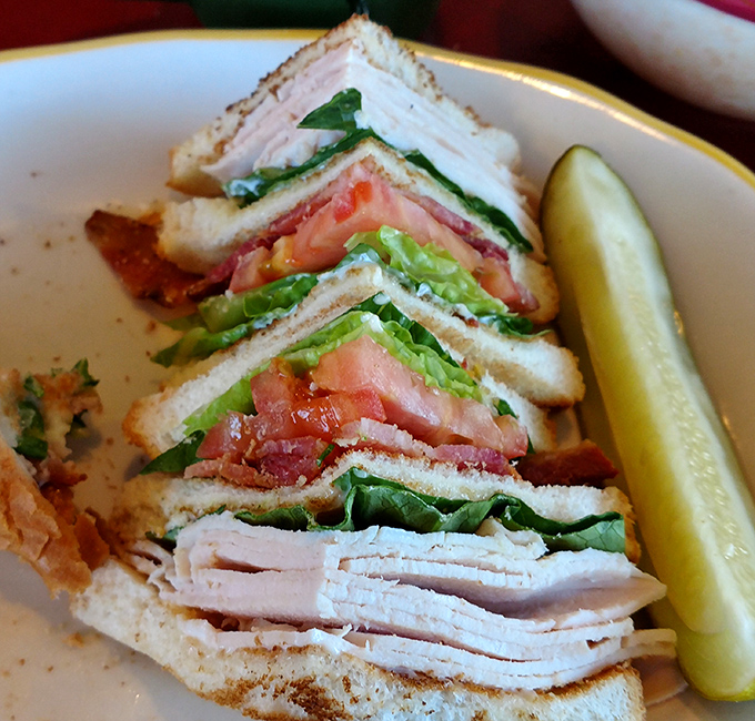This club sandwich stands tall and proud, like the architectural achievement it is. Three stories of deliciousness that requires strategic eating techniques.