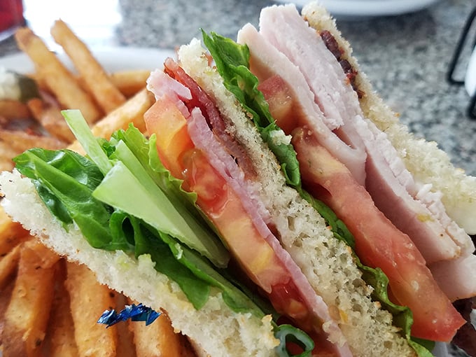 A club sandwich built with such precision and care, it could teach engineering students a thing or two about structural integrity.