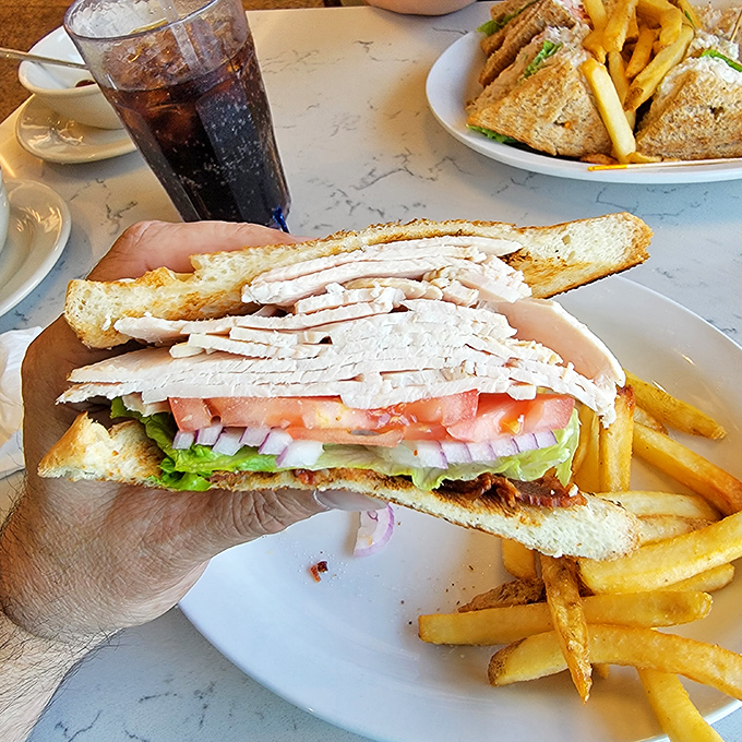 Behold the architectural marvel that is a proper club sandwich&mdash;where turkey, bacon, and vegetables achieve perfect structural harmony.