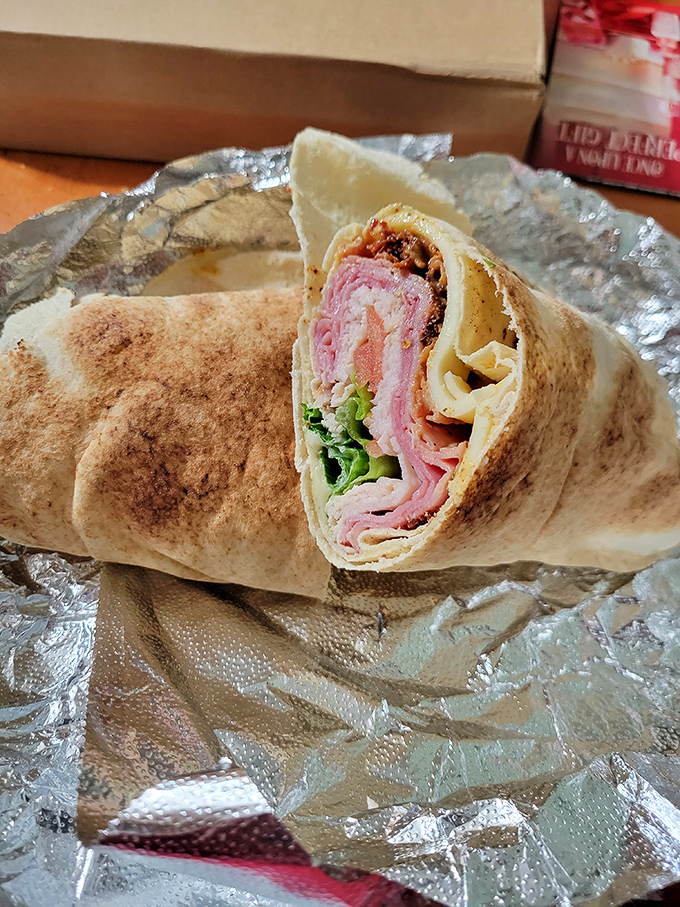 This wrap isn't just holding meats and veggies&mdash;it's cradling dreams. The cross-section reveals the architectural genius behind every bite.