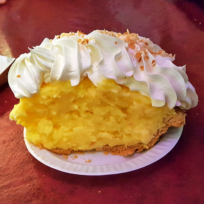 Coconut cream pie that's sunshine on a plate &ndash; the kind of dessert that makes you contemplate ordering a second slice before finishing the first.