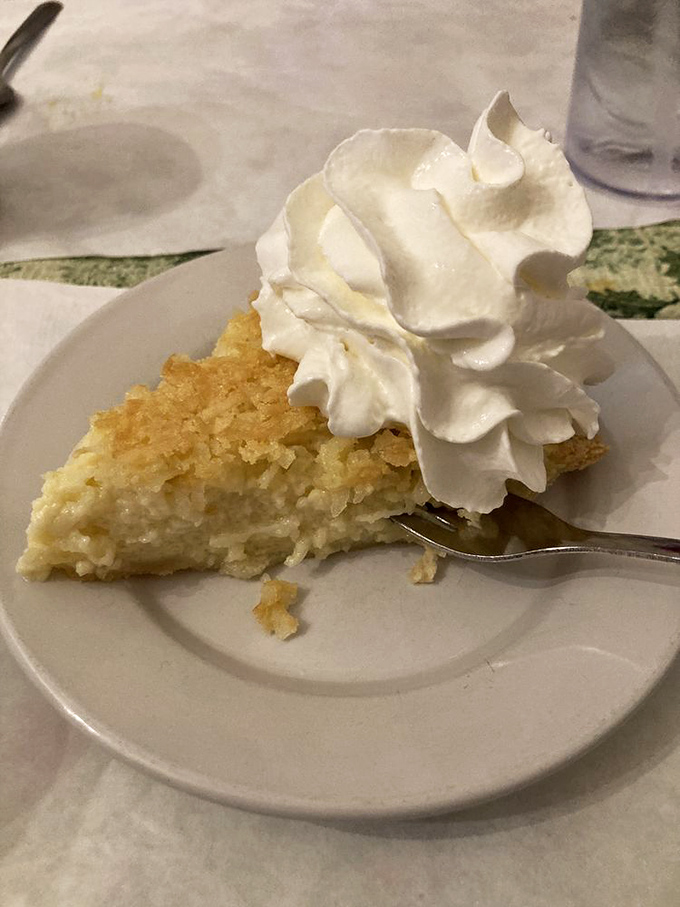 Coconut pie topped with a cloud of whipped cream&mdash;proof that sometimes the simplest desserts create the most profound happiness.