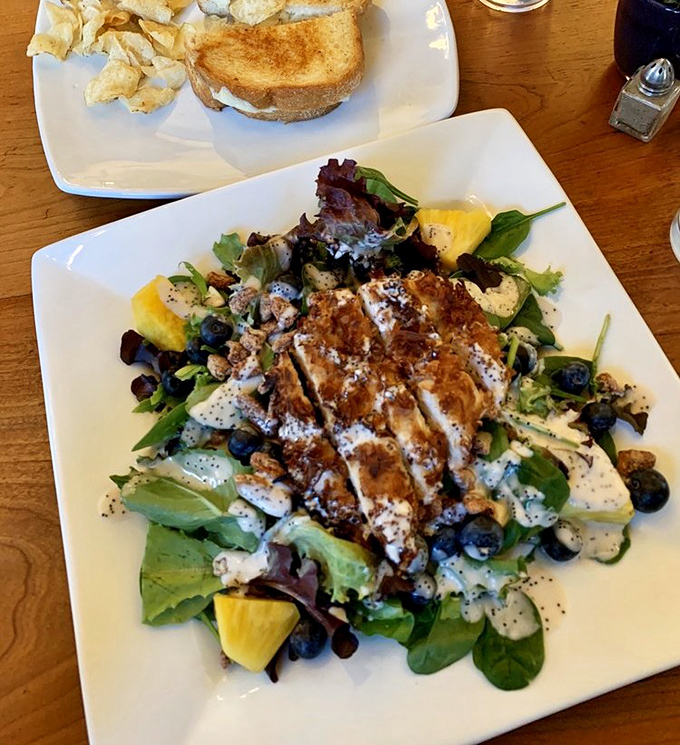 A salad that makes you forget you're eating healthy &ndash; grilled chicken, fresh greens, and berries playing together like old friends at a delicious reunion.
