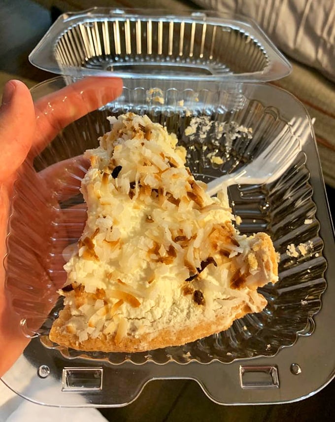 Coconut cream pie that would make your grandmother both proud and jealous, topped with toasted coconut flakes for that perfect textural contrast.