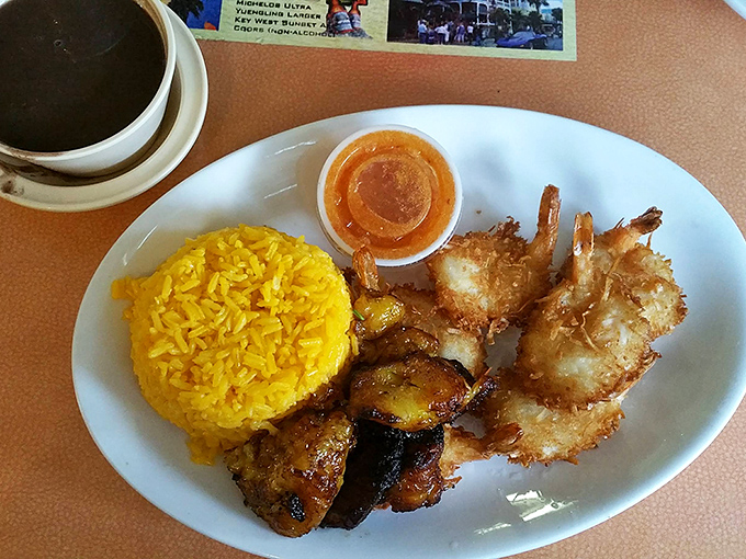 These coconut shrimp and yellow rice could make a seafood skeptic reconsider their life choices in one crispy, sweet bite.