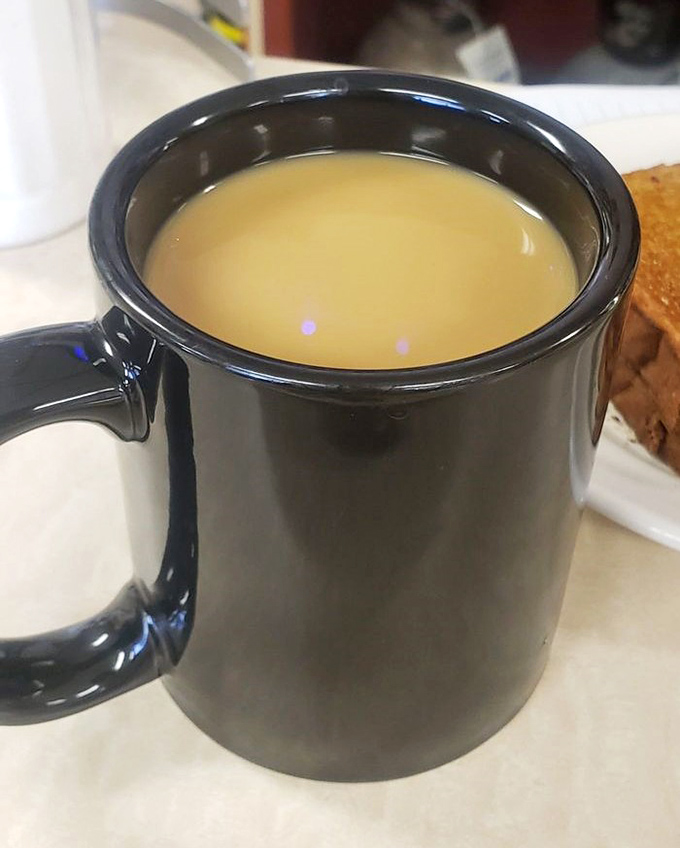 Coffee served in a sturdy mug that means business. This isn't some fancy latte art situation&mdash;this is the fuel that's powered Ohio mornings for generations. 
