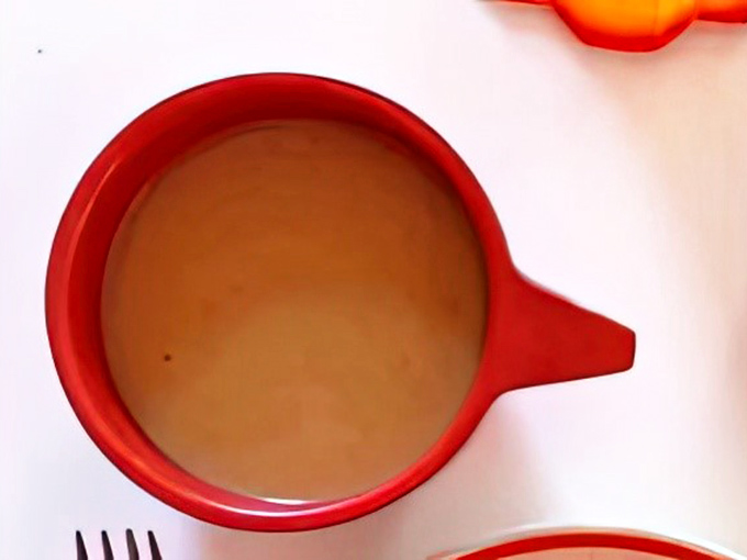 Coffee in that perfect red mug - the supporting actor that deserves an award for making every sweet bite even better.