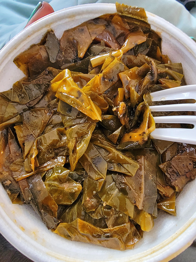 These collard greens have more depth than most Hollywood scripts. The fork says it all: resistance is futile.