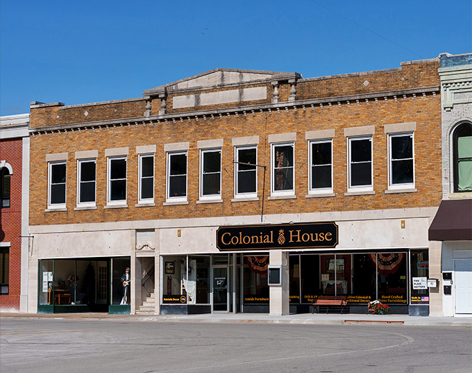 Colonial House maintains its dignified brick presence on the square, looking like it's patiently waiting for someone to invent color photography.