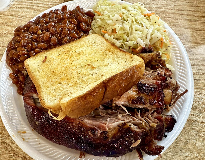 The barbecue plate that dreams are made of&mdash;pulled pork with perfect bark, baked beans swimming in sweet-savory sauce, and coleslaw for that essential crunch factor.