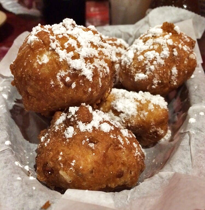 These corn fritters dusted with powdered sugar are what would happen if a hushpuppy went to pastry school &ndash; crispy, sweet little clouds of joy.