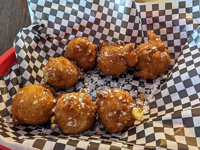 Hush puppies that would make any Southern grandmother nod in approval. These golden orbs of cornmeal joy are worth every delicious calorie.