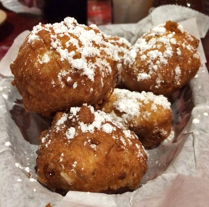 These powdered sugar-dusted corn fritters aren't just appetizers&mdash;they're warm, golden orbs of happiness that grandma wishes she could make.