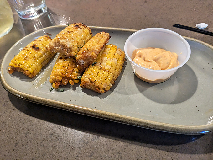 Corn reimagined as nature's perfect finger food. These golden beauties have been transformed through fire and spice into something transcendent.