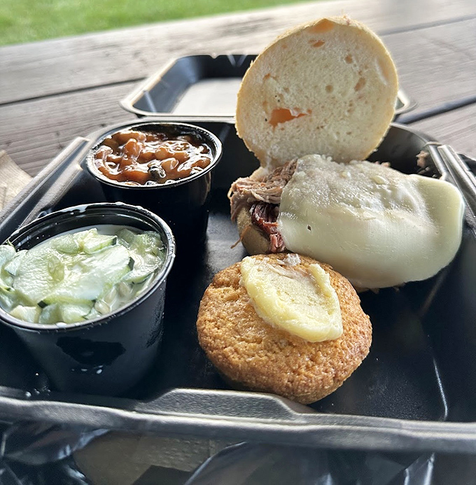 A pulled pork sandwich with sides that aren't playing second fiddle. That cornbread muffin with honey butter deserves its own standing ovation.