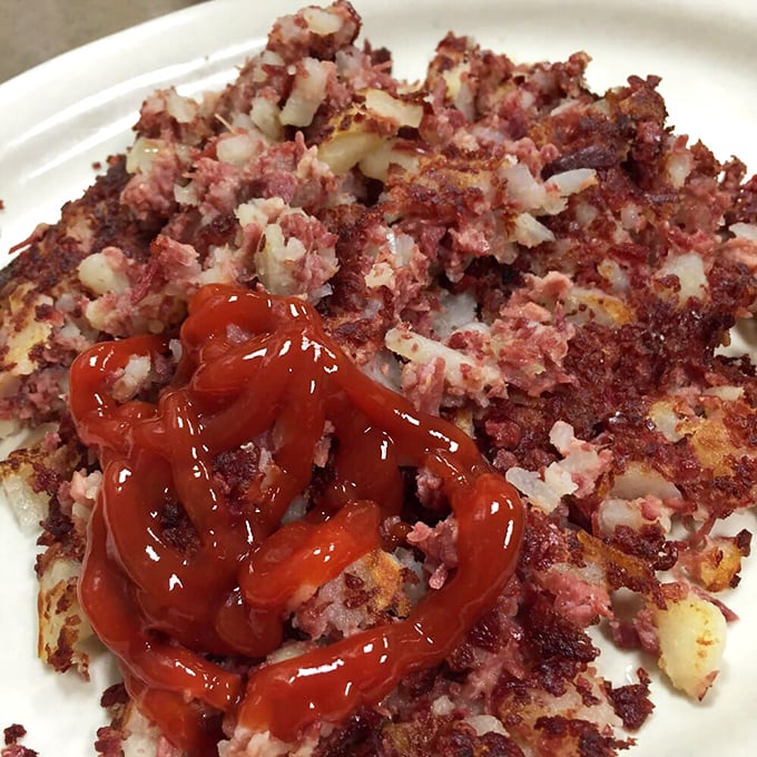 Corned beef hash that makes you question every other breakfast you've ever had. That splash of ketchup isn't decoration—it's tradition.
