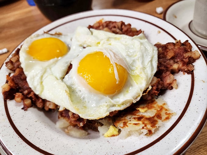 Corned beef hash topped with sunny-side-up eggs&mdash;the breakfast equivalent of hitting the lottery twice in one day.