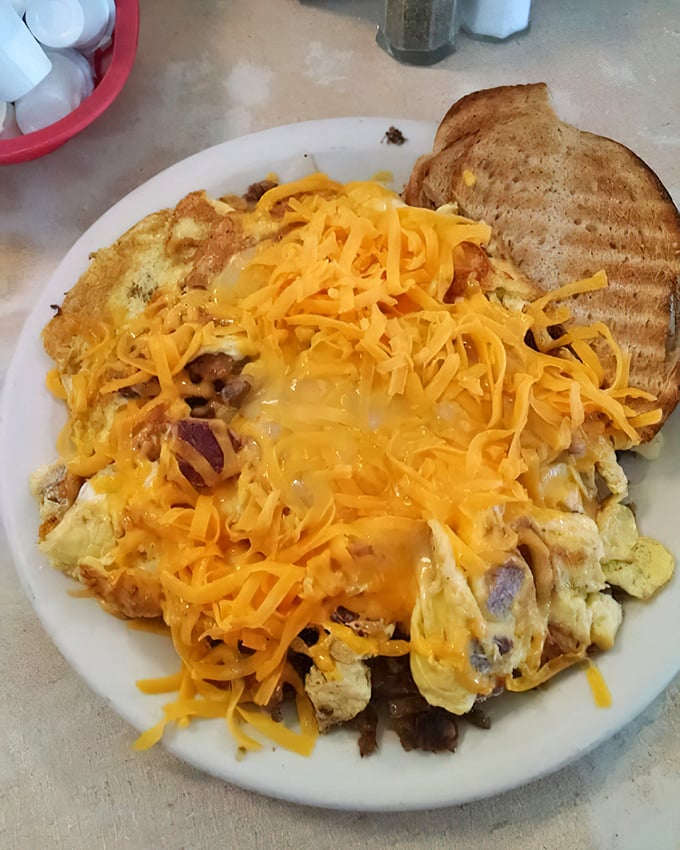 The Corned Beef Scrambler doesn't just feed you&mdash;it fortifies you for whatever the day might throw your way, crowned with a sunshine-yellow cheese blanket.