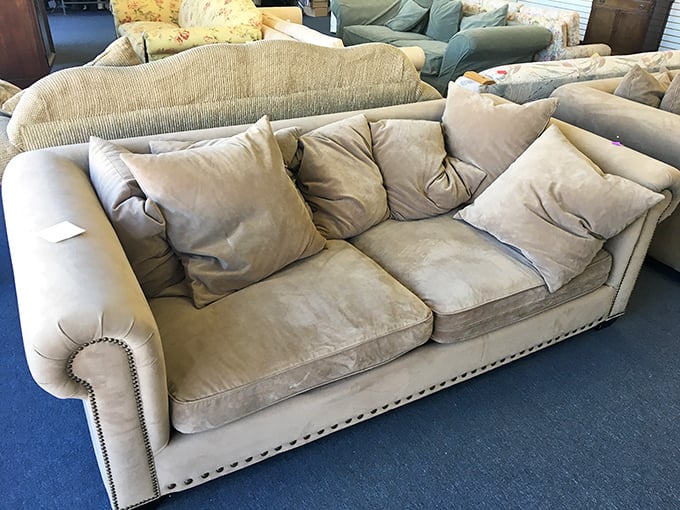 This couch has seen things. With those pillows and that neutral tone, it's ready for its second act in someone's living room.