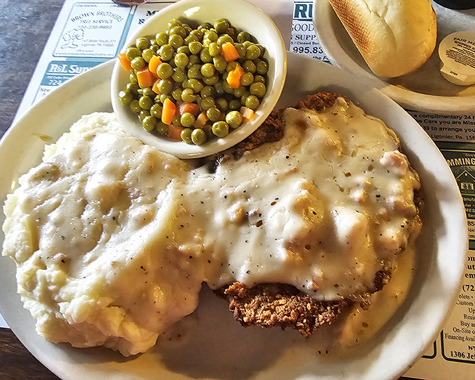 Country fried steak that deserves its own zip code. Crispy exterior, tender interior, and gravy that should be classified as a controlled substance.