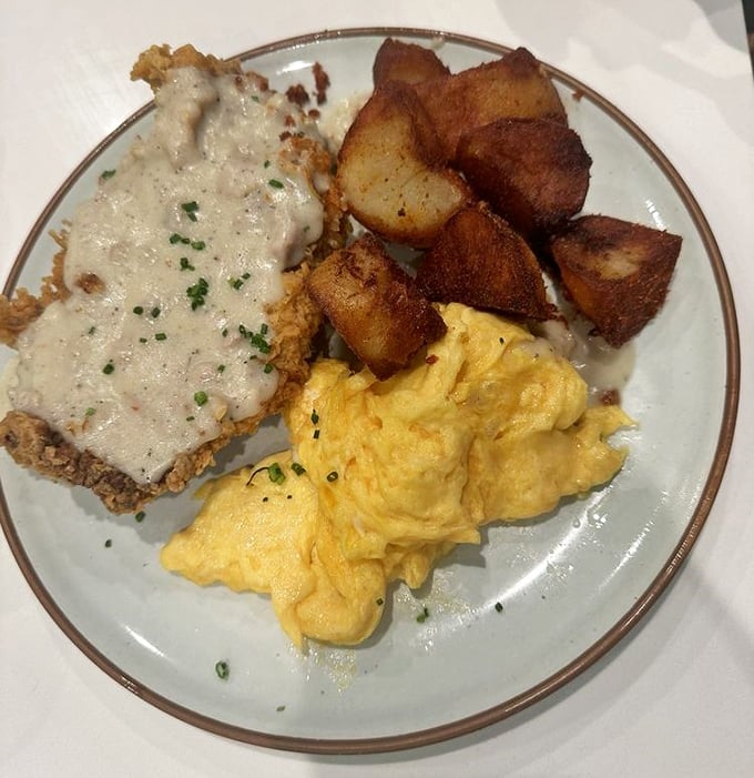 Country fried steak with gravy, scrambled eggs, and home fries&mdash;the kind of breakfast that makes you want to cancel your plans for the day and take a nap.
