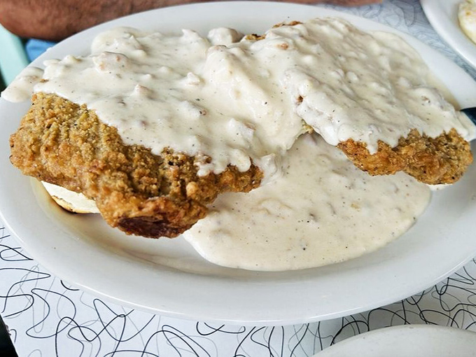 Country fried steak swimming in gravy&mdash;proof that sometimes the most beautiful things in life aren't meant to be photographed but devoured immediately.