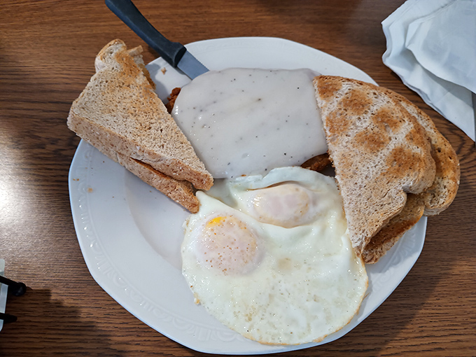 Breakfast done right doesn't need fancy tricks&mdash;just perfectly cooked eggs, toast, and a generous portion of country-fried goodness.