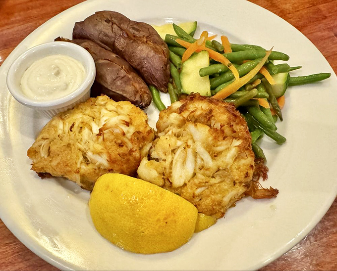 Crab cakes that are actually crab, not breadcrumbs with a seafood rumor. Paired with a baked potato and veggies that didn't come from the freezer.