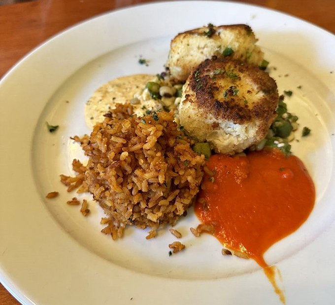 These crab cakes are what other crab cakes dream of becoming&mdash;mostly crab, minimal filler, perfectly seared, with Charleston red rice playing a supporting role.