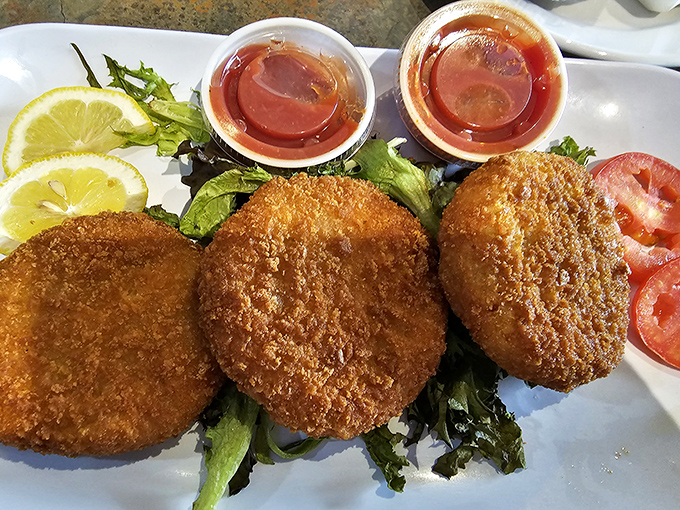 Golden-fried crab cakes that crunch like autumn leaves. The dipping sauce isn't just an option&mdash;it's the perfect dance partner for these crispy delights. 