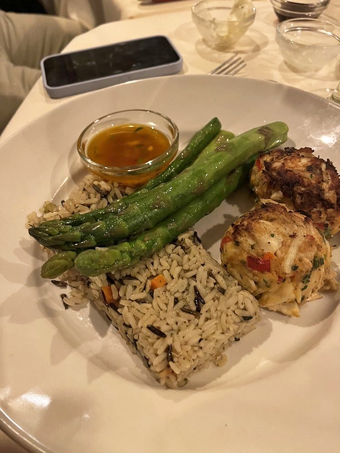 These crab cakes aren't just seafood&mdash;they're little islands of flavor surrounded by a sea of wild rice and perfectly cooked asparagus.