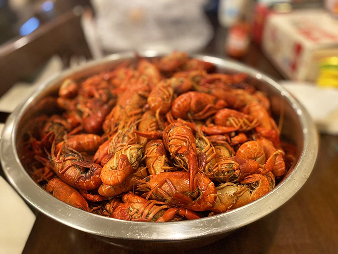 A mountain of crimson crawfish that looks like it should have its own ZIP code. Southern seafood boils don't get more authentic than this.
