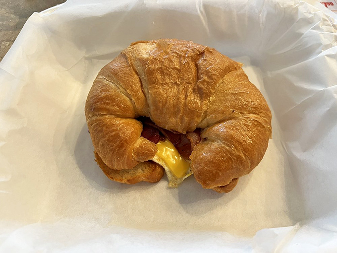 The humble croissant sandwich &ndash; proof that sometimes the simplest combinations create the most satisfying morning companions.