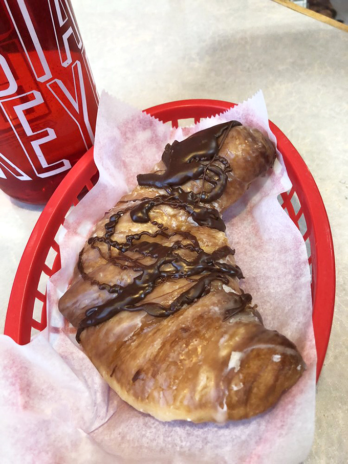 A pastry drizzled with chocolate that whispers, "Diet plans are just suggestions," and somehow makes you completely okay with that.