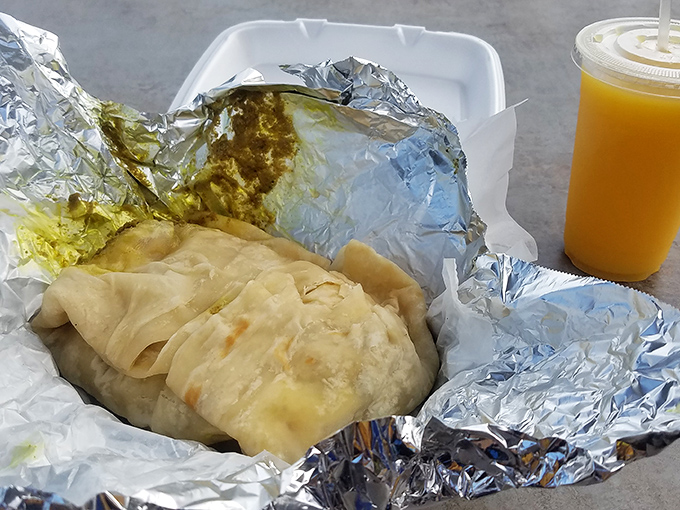 Roti: the Caribbean's answer to the burrito. This pillowy flatbread wrapped around curry chicken creates the perfect handheld flavor delivery system.