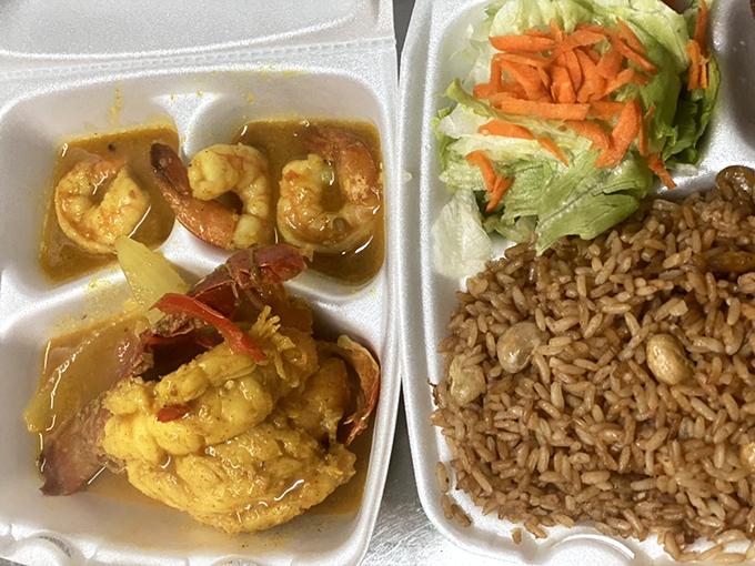 Curry shrimp that's swimming in flavor rather than oil. The rice and peas stand ready to soak up that liquid gold.