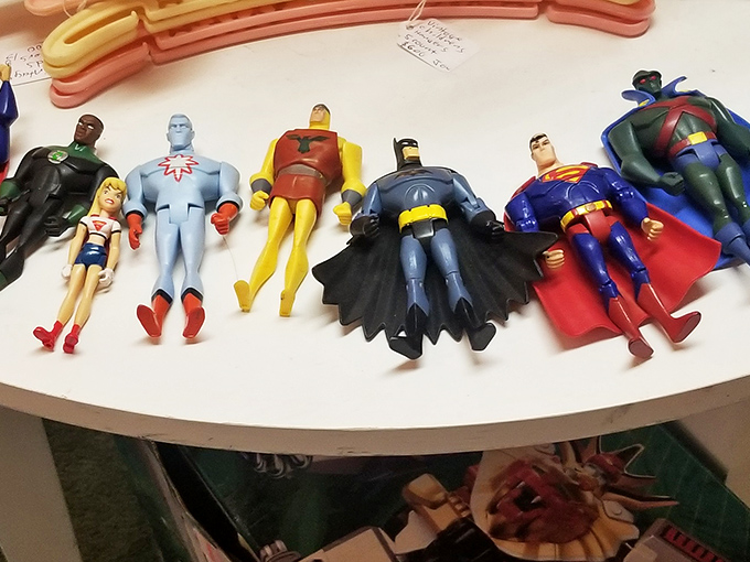 The Justice League taking a well-deserved break from saving the world, lined up like they're waiting for you to take them home.