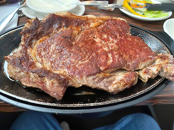 The Delmonico steak arrives with the confidence of someone who knows they're the best-looking person in the room. That sear tells stories.