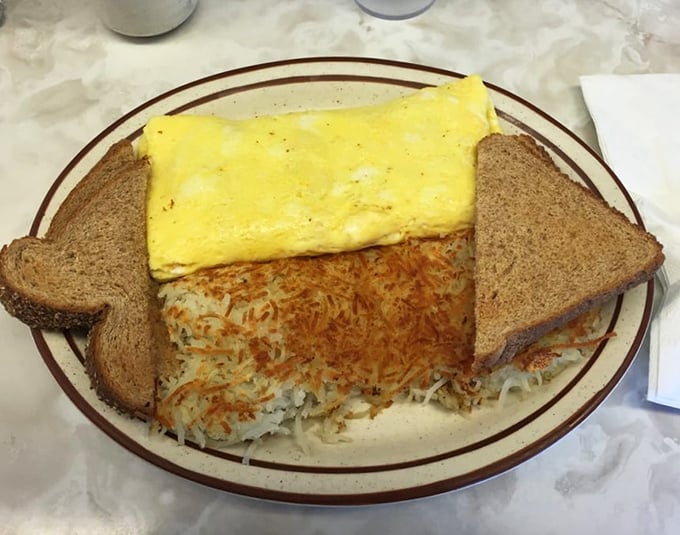 The Denver omelet arrives like a savory gift wrapped in golden egg &ndash; Colorado's loss is Oregon's delicious gain.