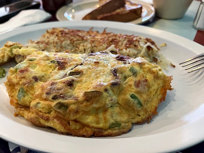 This omelet didn't just incorporate vegetables&mdash;it conquered them, creating a fluffy yellow fortress of breakfast perfection that demands your full attention.