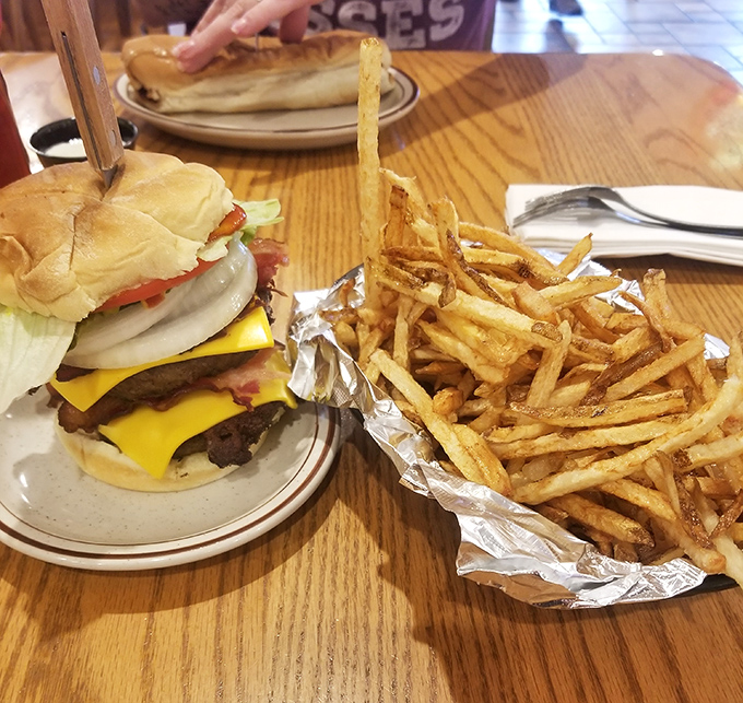 A double cheeseburger that demands both hands and possibly a nap afterward. Those hand-cut fries aren't just a side&mdash;they're the supporting actor who steals the scene.